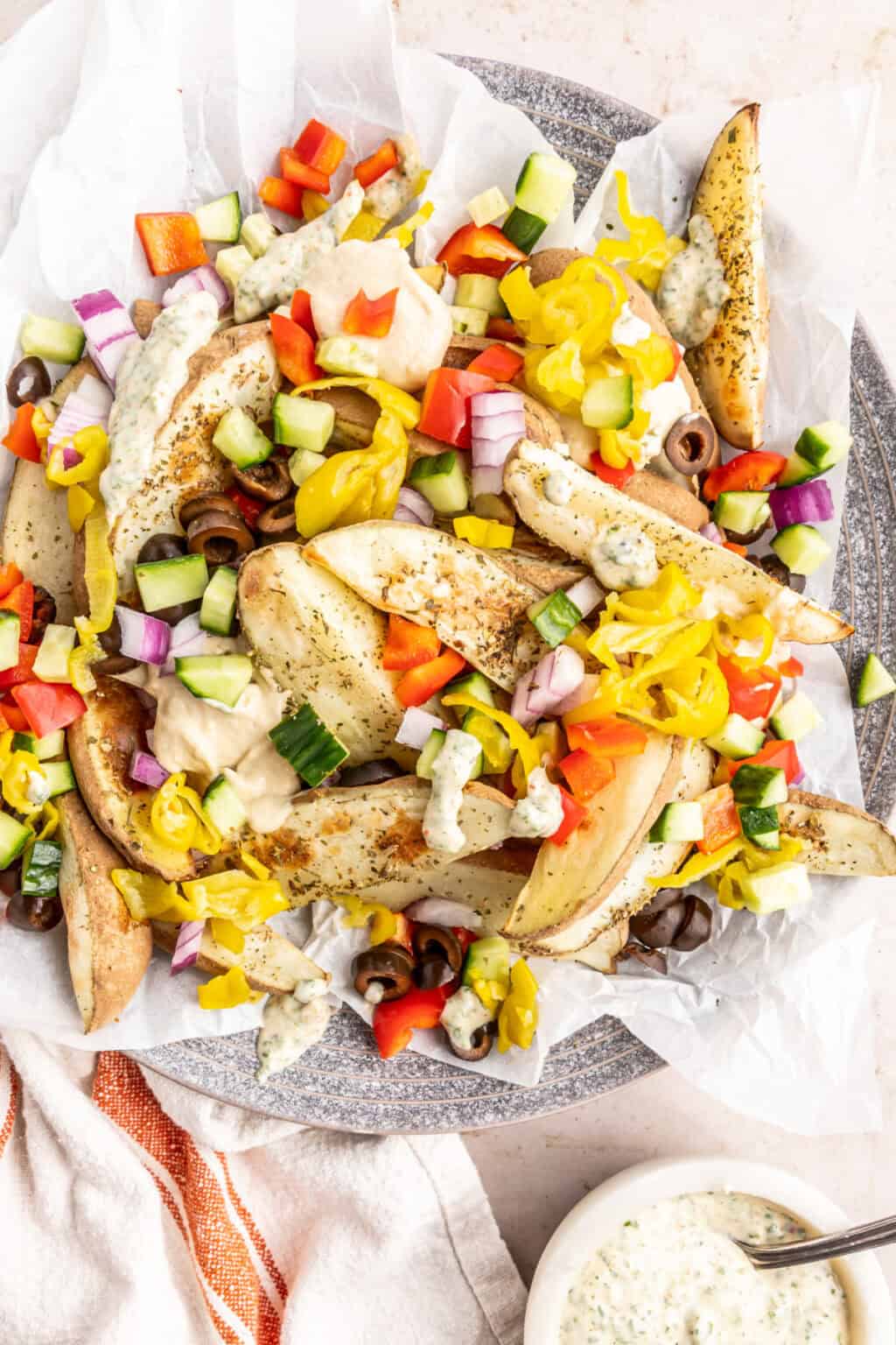 Loaded Mediterranean Potato Wedges - Love Bakes Good Cakes